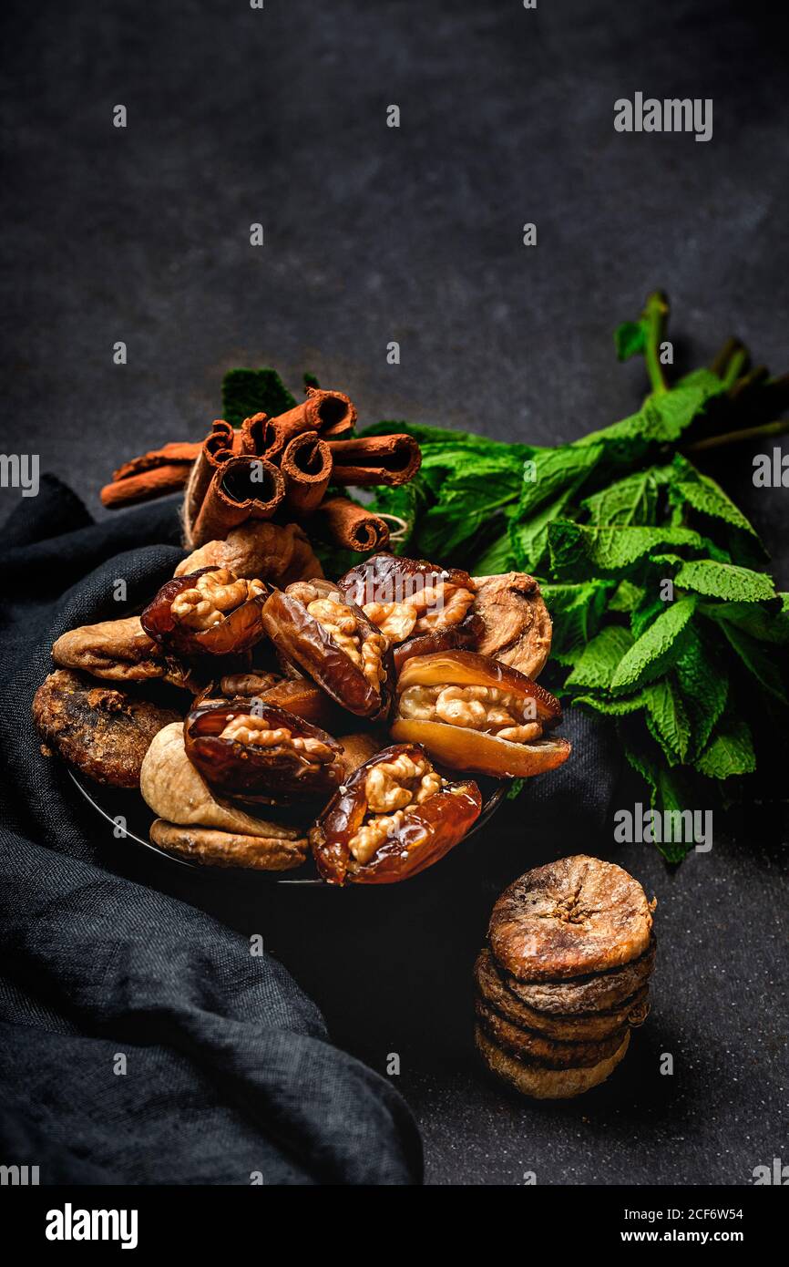 Dates fruits with and dried figs , mint and cinnamon muslim halal snack ...