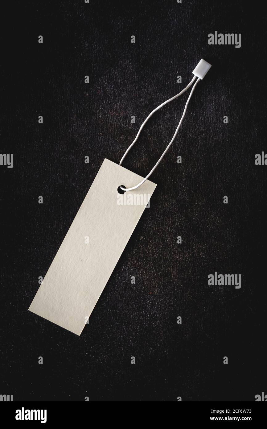 Cardboard labels for price or advertising on dark background. Flat lay ...