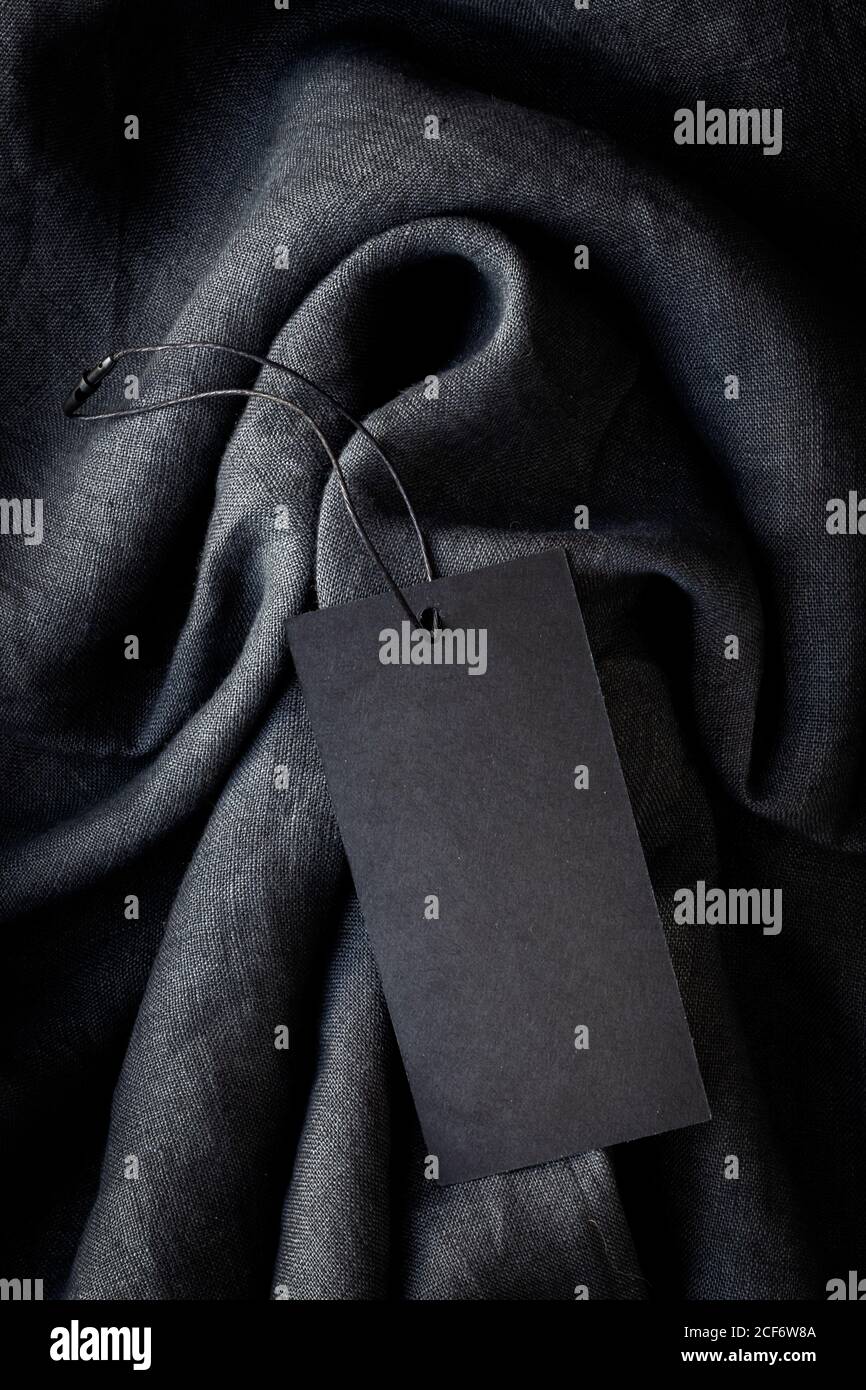 Cardboard labels for price or advertising on dark background. Flat lay ...