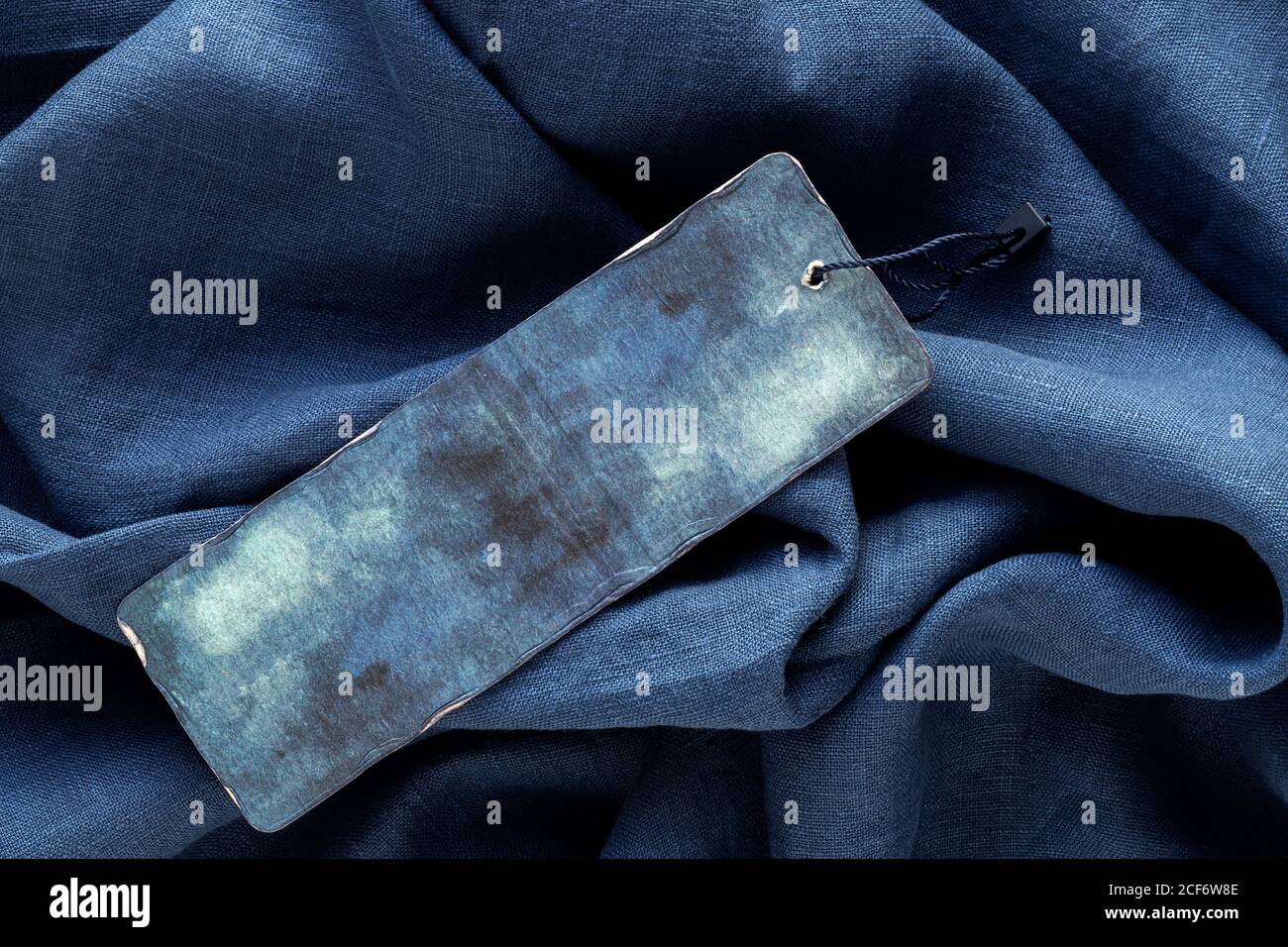 Cardboard labels for price or advertising on blue background. Flat lay ...