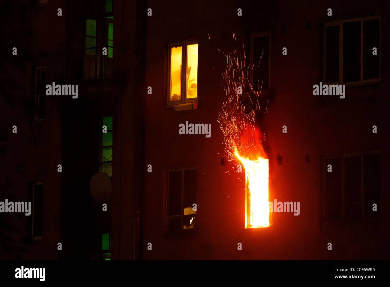 a residential apartment building is on fire at night Stock Photo - Alamy