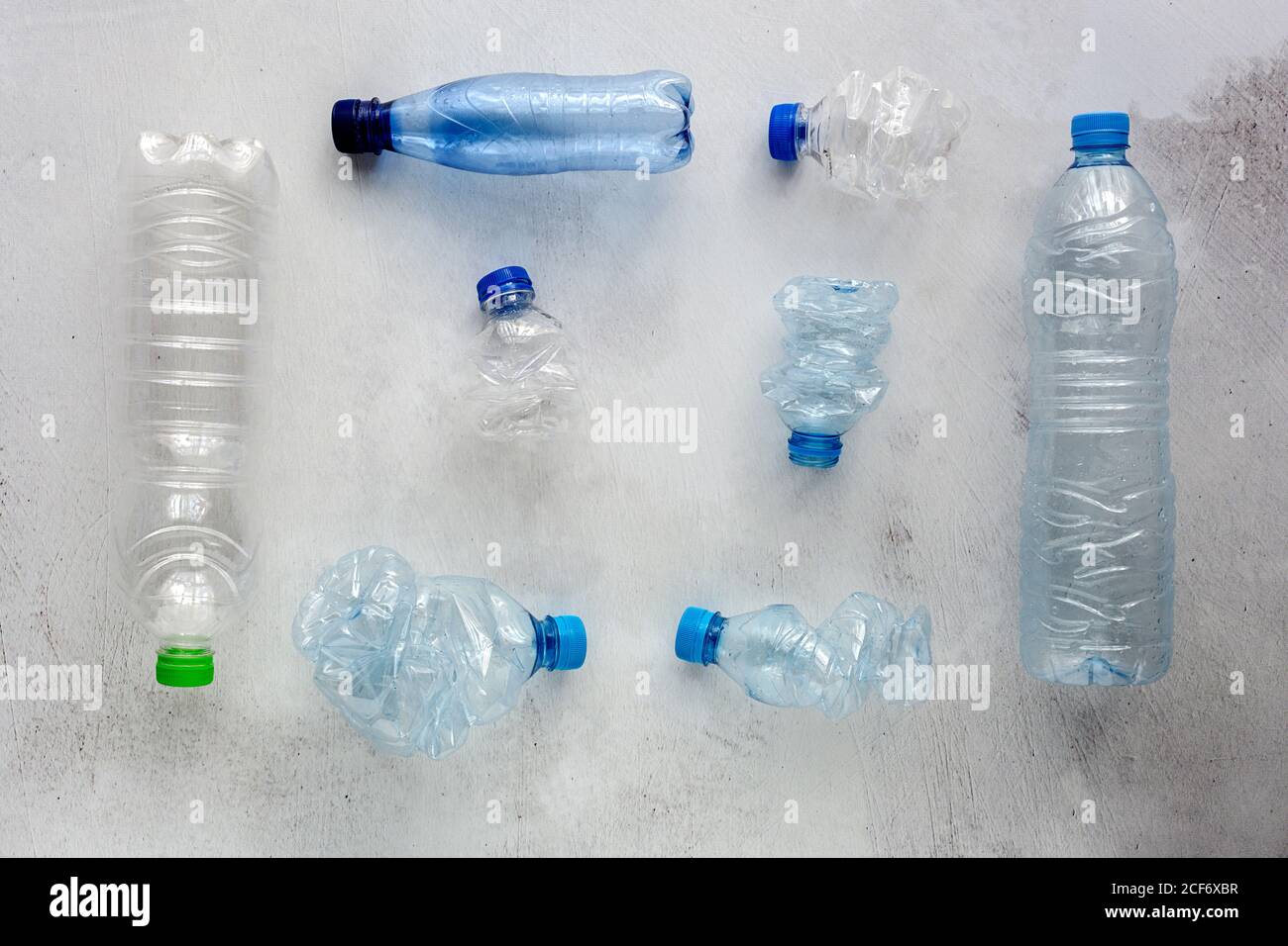 Top view of plastic bottles and boxes arranged on white background ...