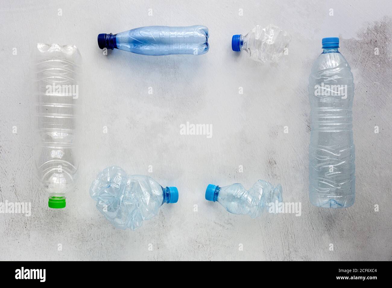 Top view of plastic bottles and boxes arranged on white background ...