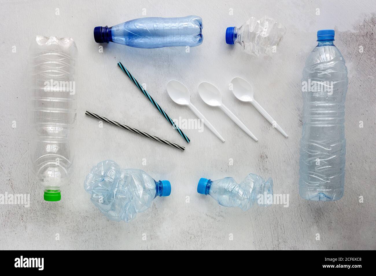 Top view of plastic bottles and boxes arranged on white background ...