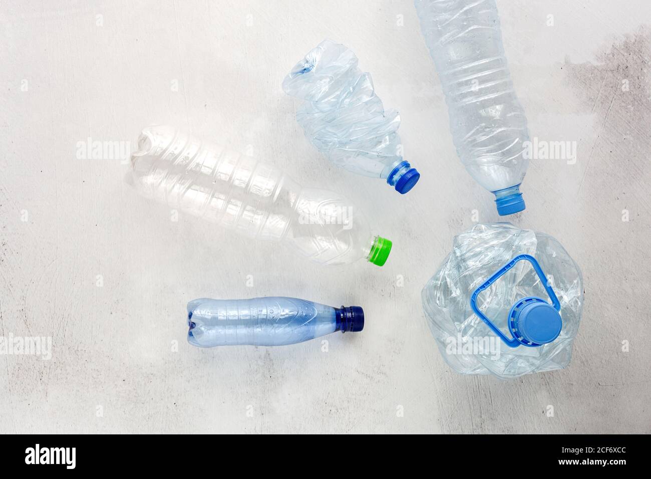 Top view of plastic bottles and boxes arranged on white background ...