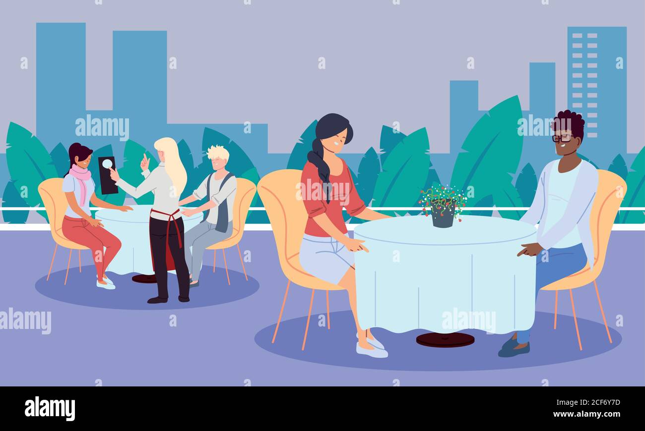 People dining in an upscale outdoor luxury restaurant and waiters ...