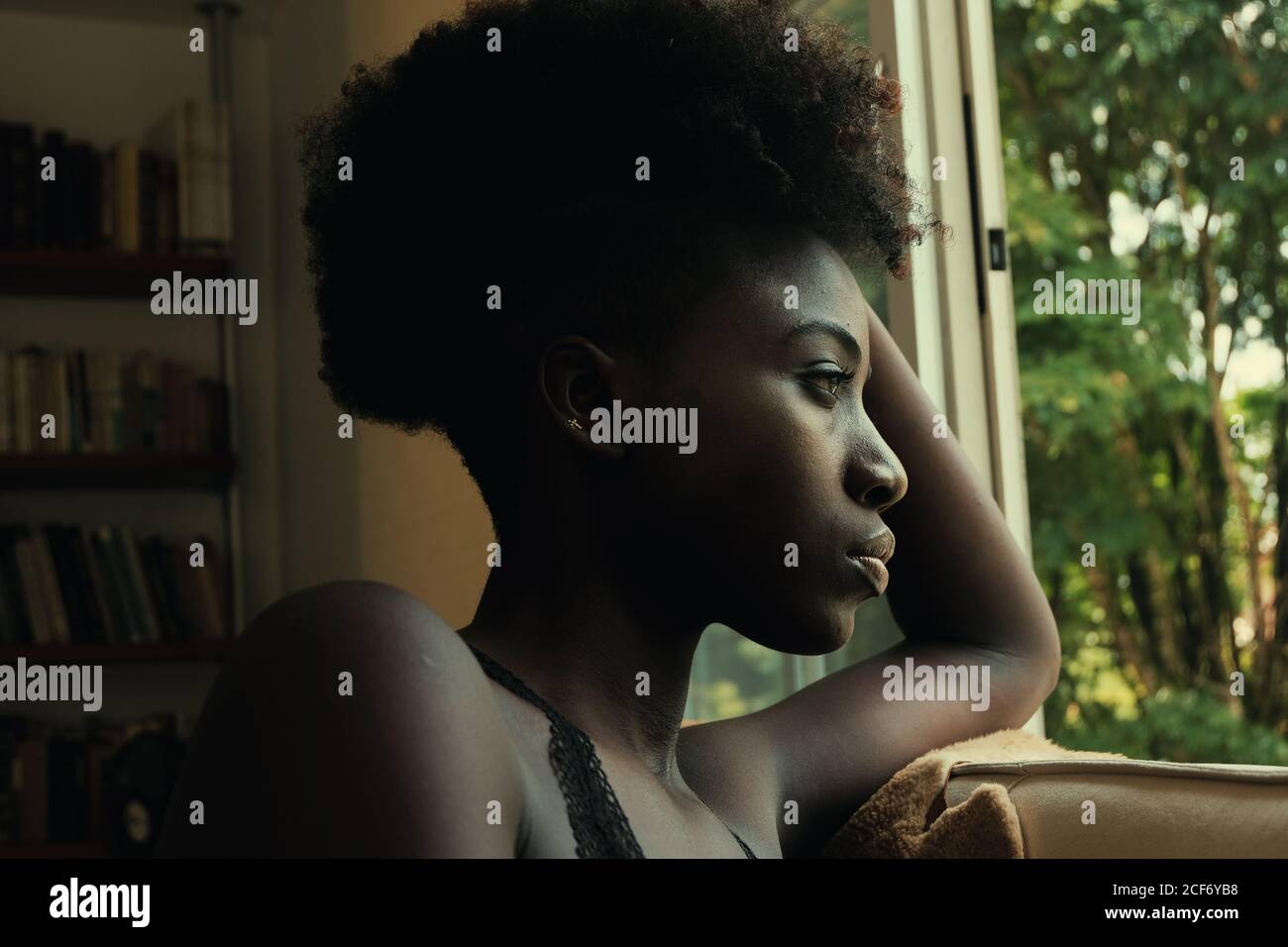 Side view of African American mysterious disappointed resentful sad ...
