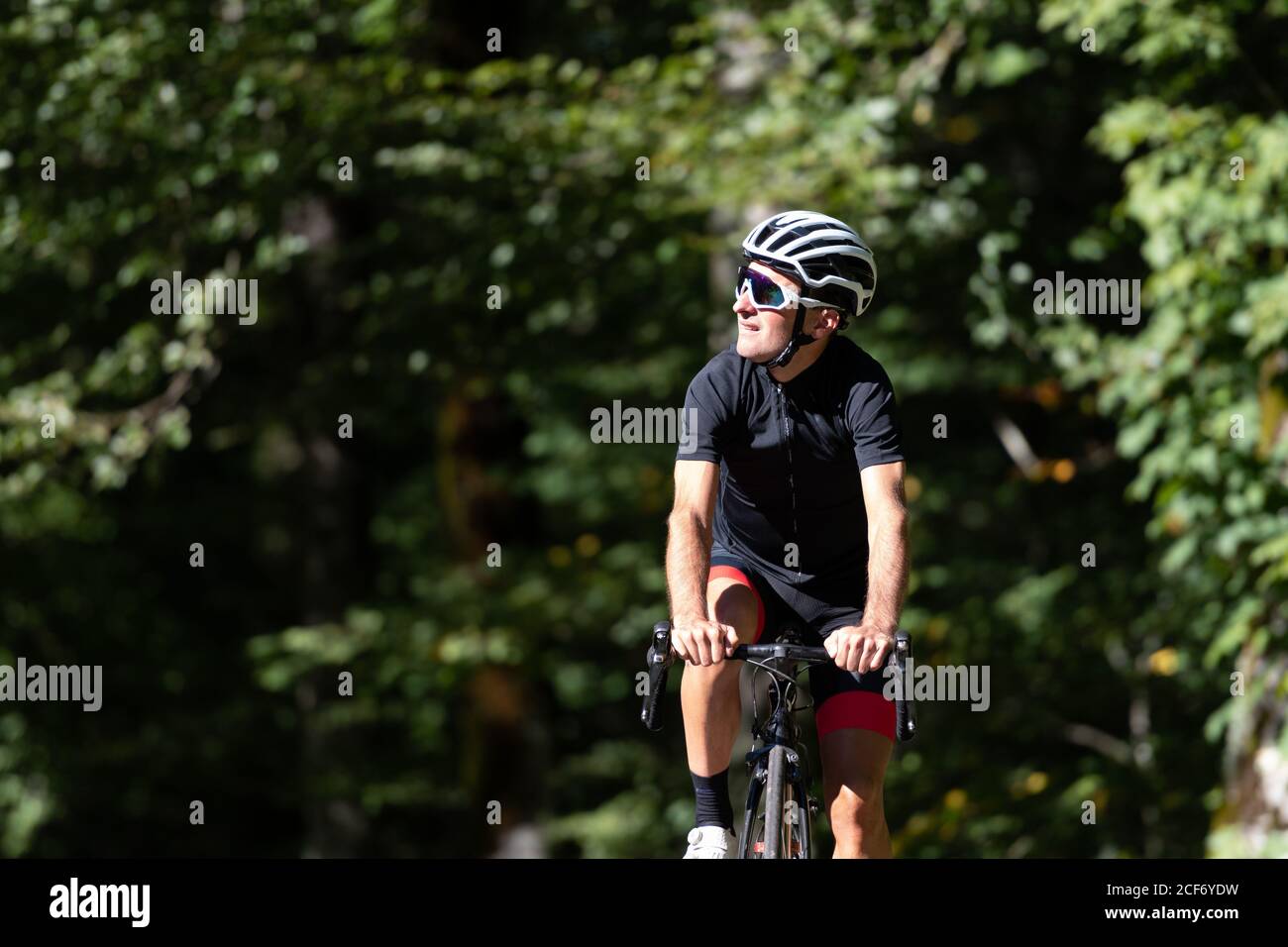 Professional cyclist in helmet looking hi-res stock photography and ...