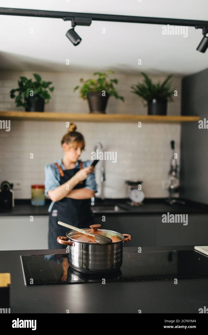 Leaning on counter hi-res stock photography and images - Alamy