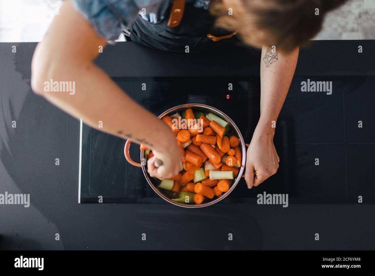 Woman cooking soup hi-res stock photography and images - Alamy