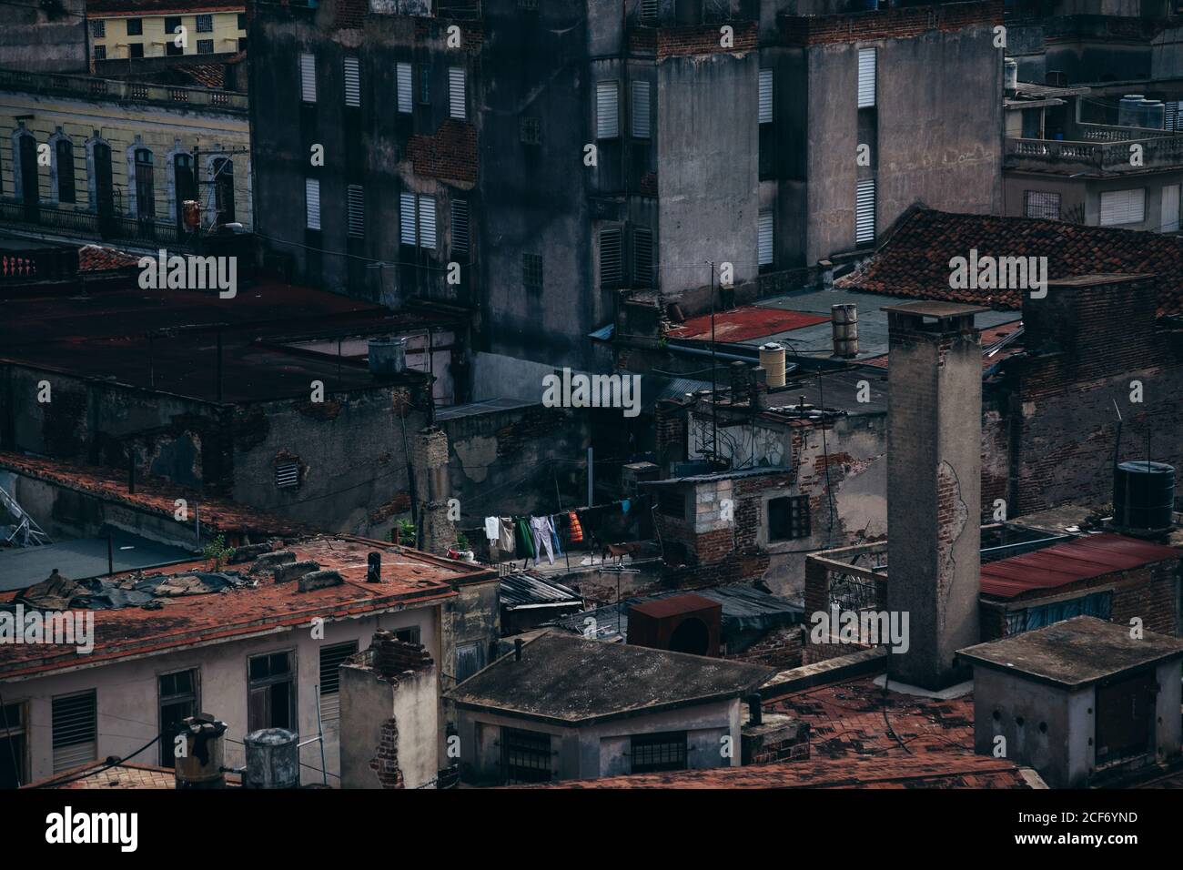 From above of colorful buildings and skyscraper with blue sky on ...