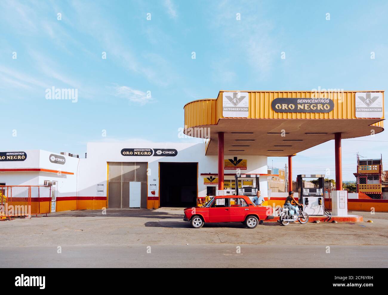 Santiago de Cuba, Cuba - DECEMBER 16, 2019: Red retro car standing next ...