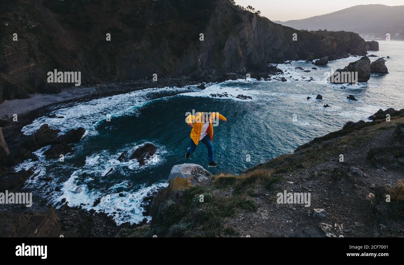 Person jumping into water sunset hi-res stock photography and images ...