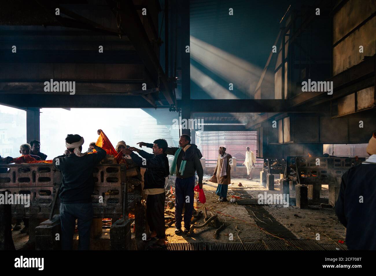 Varanasi, India - February, 2018: Indian men setting fire on pyre ...