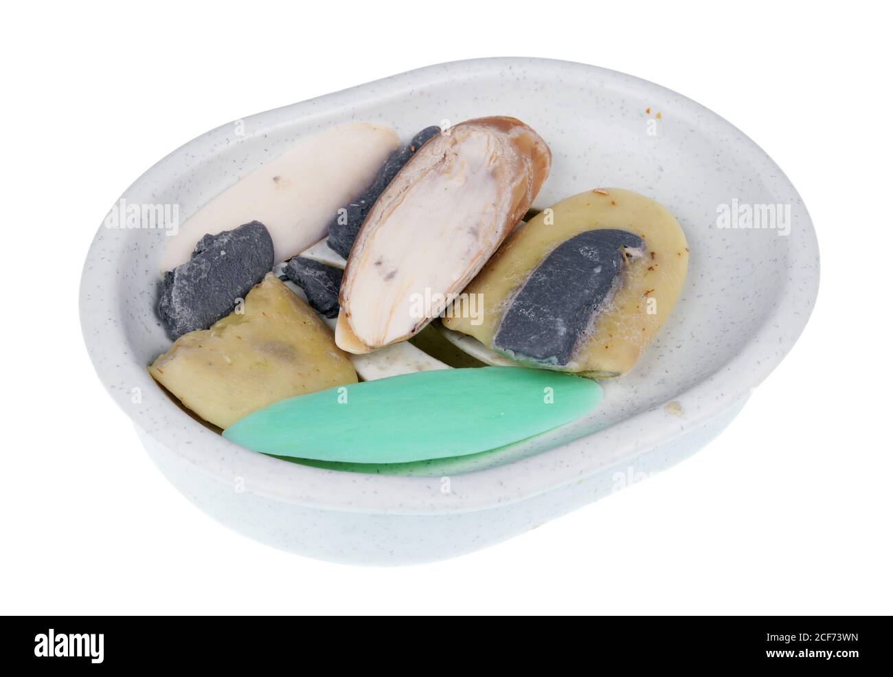 Old rustic dry cracked soap slices in plastic broken dishe. Isolated ...