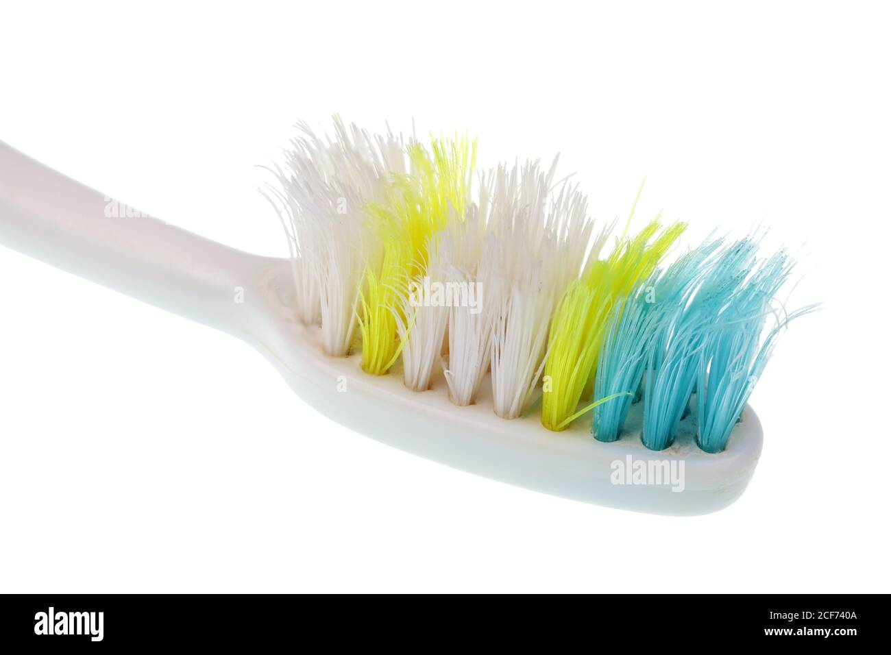 Old toothbrush with worn out bristles isolated macro Stock Photo - Alamy