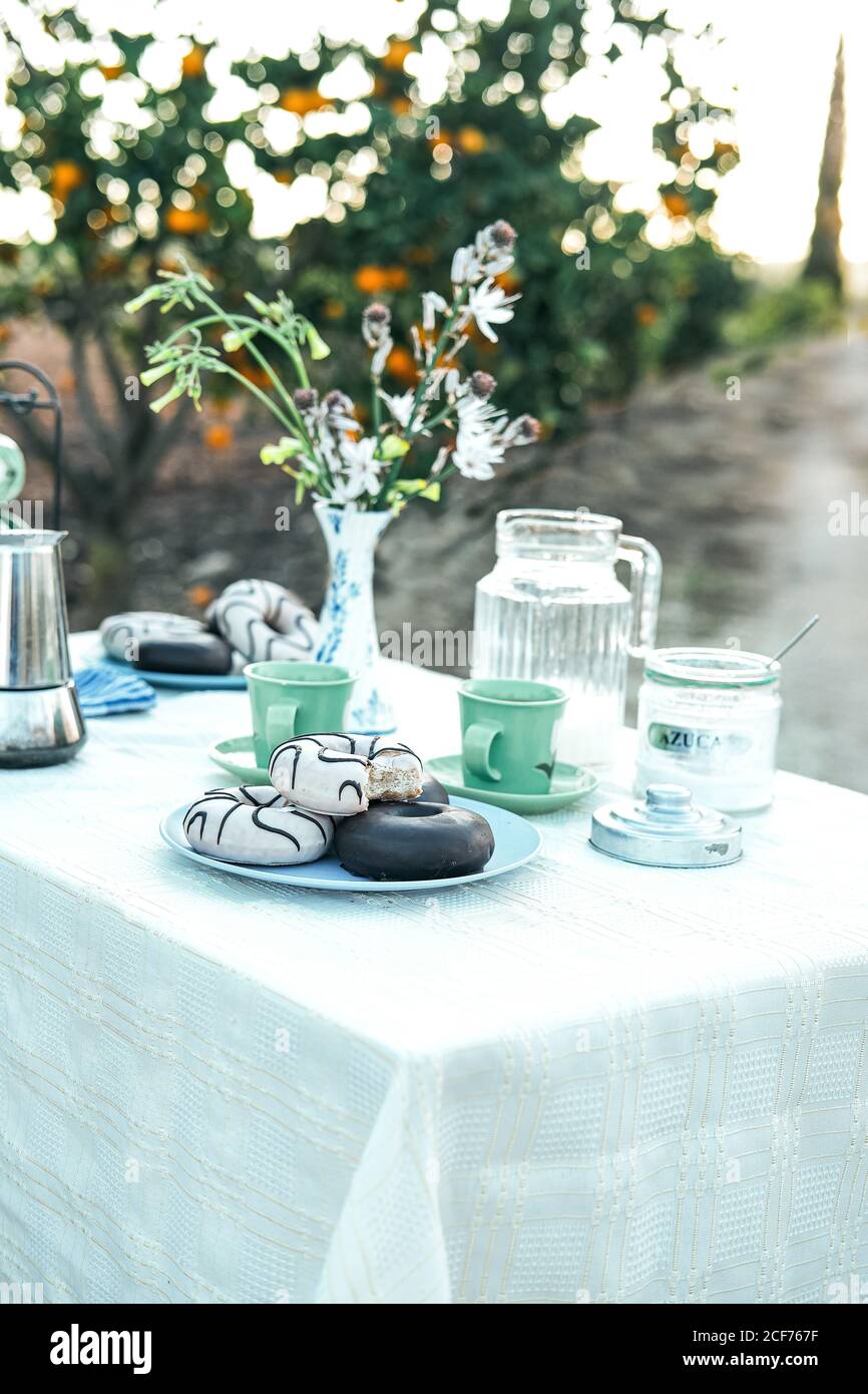 Picnic with yummy dessert and aromatic coffee in garden Stock Photo - Alamy