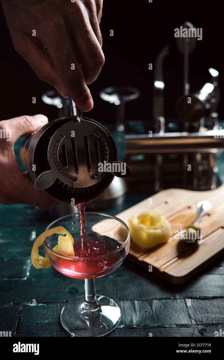 Hand cocktail glass spill hi-res stock photography and images - Alamy
