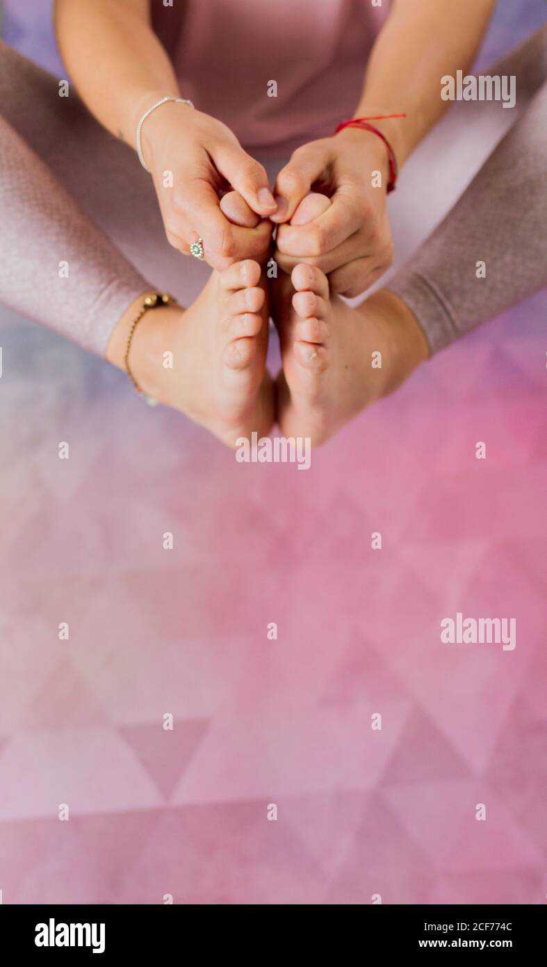 Hands to feet pose hi-res stock photography and images - Alamy