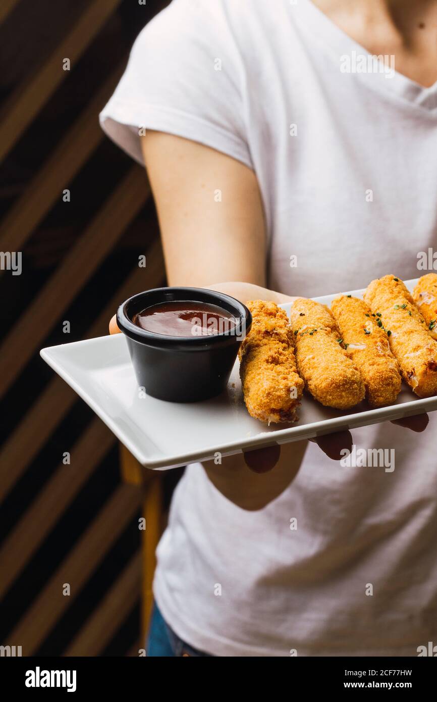Chicken fillet in batter and red sauce Stock Photo - Alamy