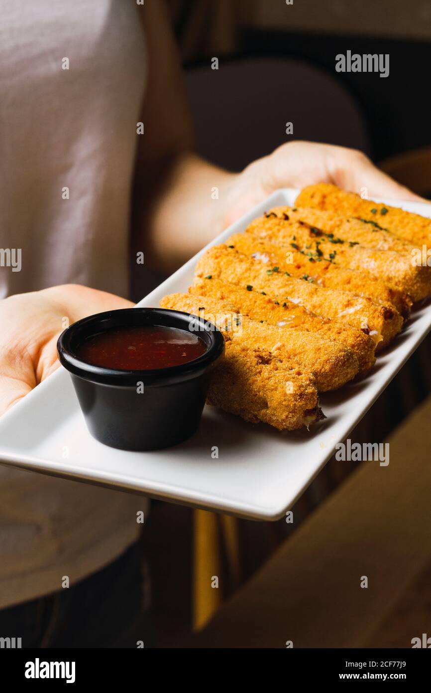 Chicken fillet in batter and red sauce Stock Photo - Alamy