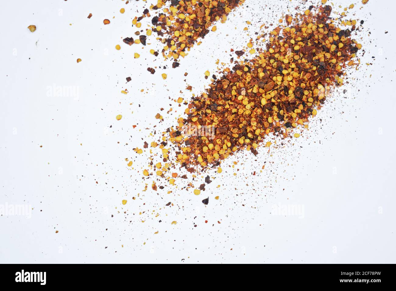 Red hot Chili pepper powder on white background Stock Photo - Alamy