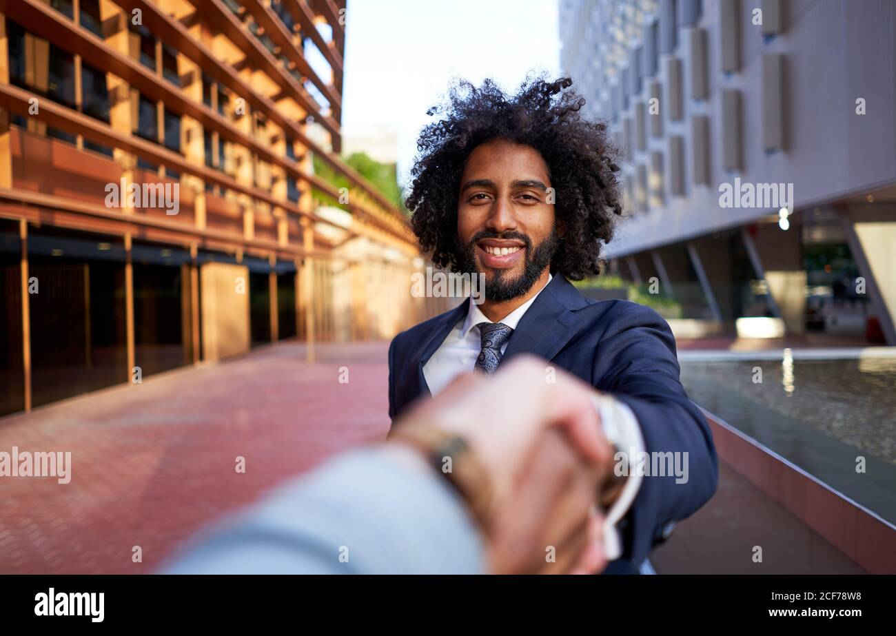 Businessman handshake to camera hi-res stock photography and images - Alamy