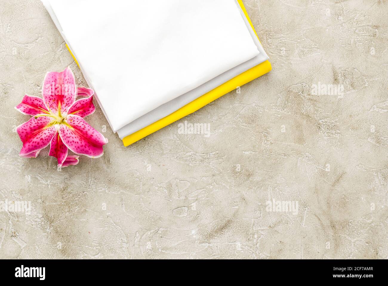 Clean laundry - clothes and towels top view Stock Photo - Alamy