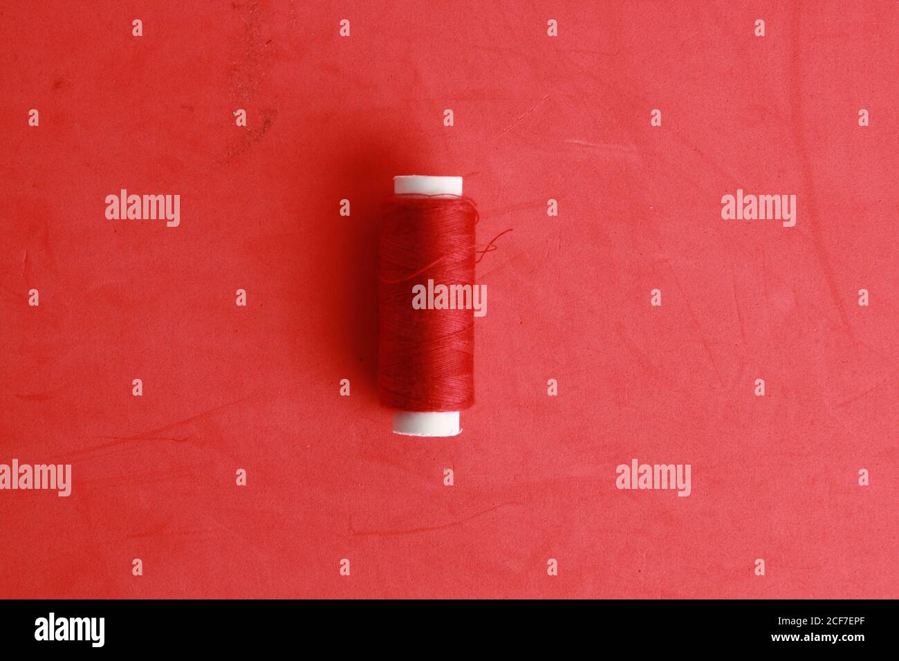 Top view of the red sewing thread Stock Photo - Alamy