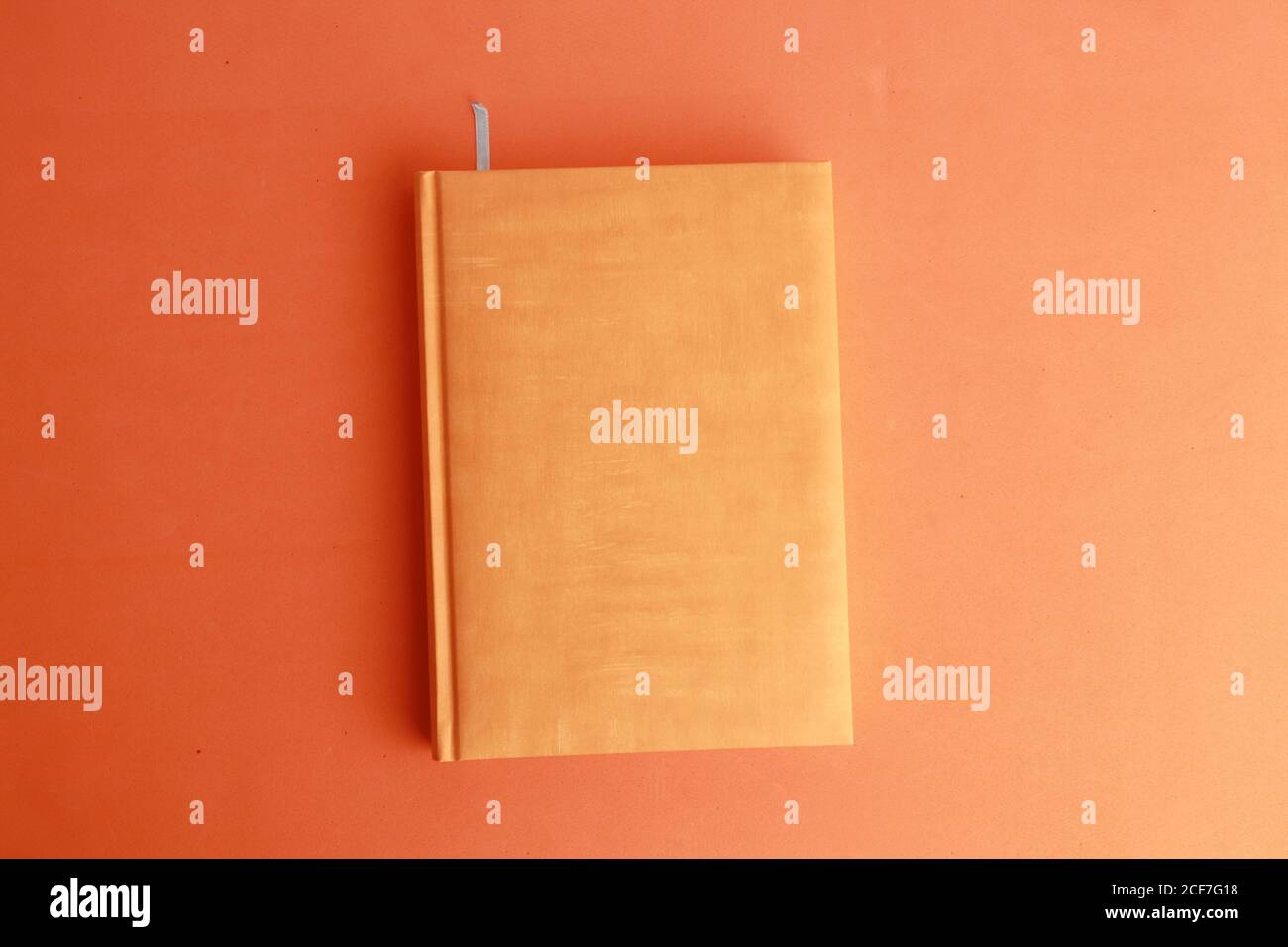 Top view of a notebook with orange leather cover Stock Photo - Alamy