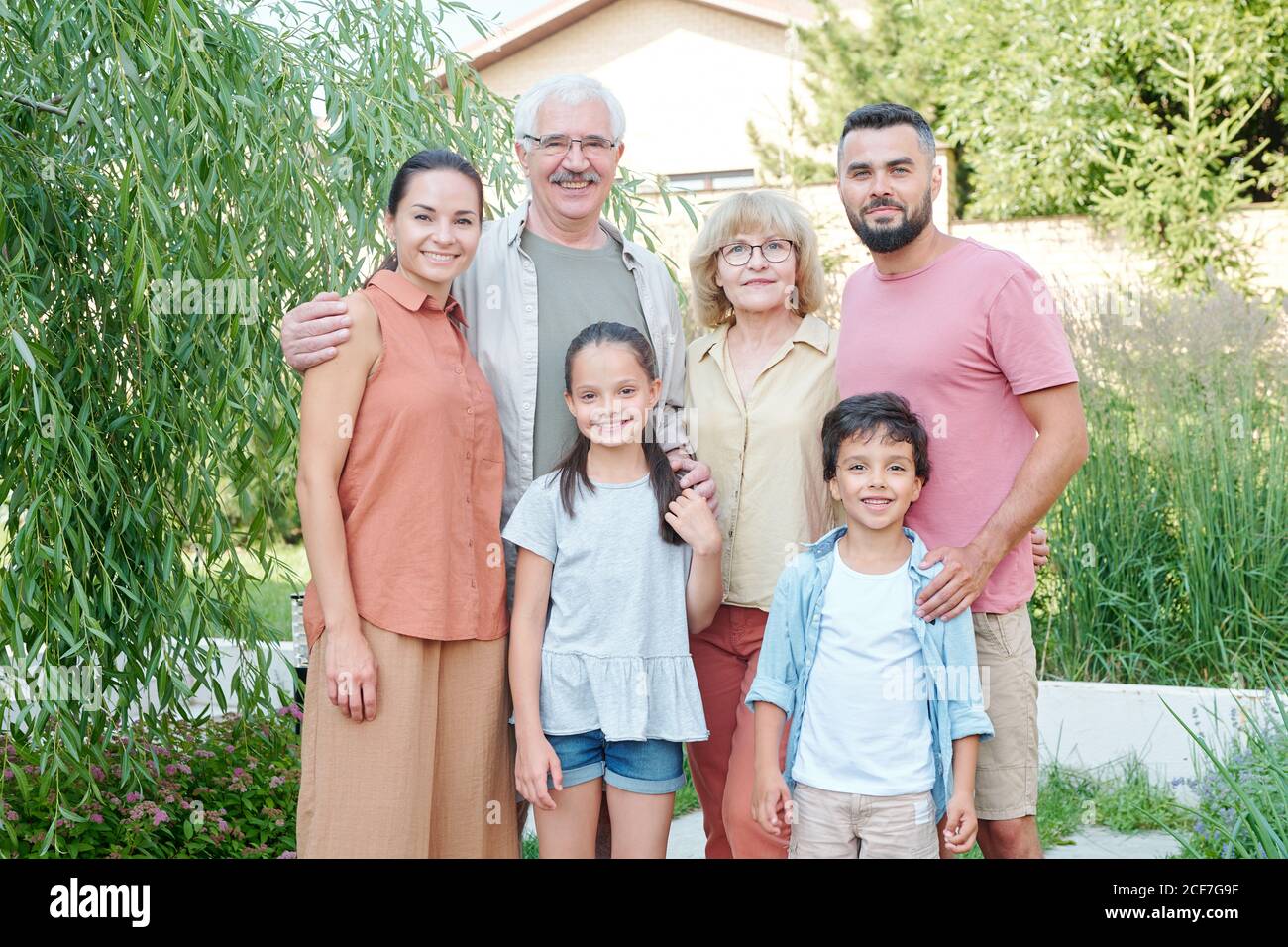 Horizontal medium long portrait if big family consisting of ...