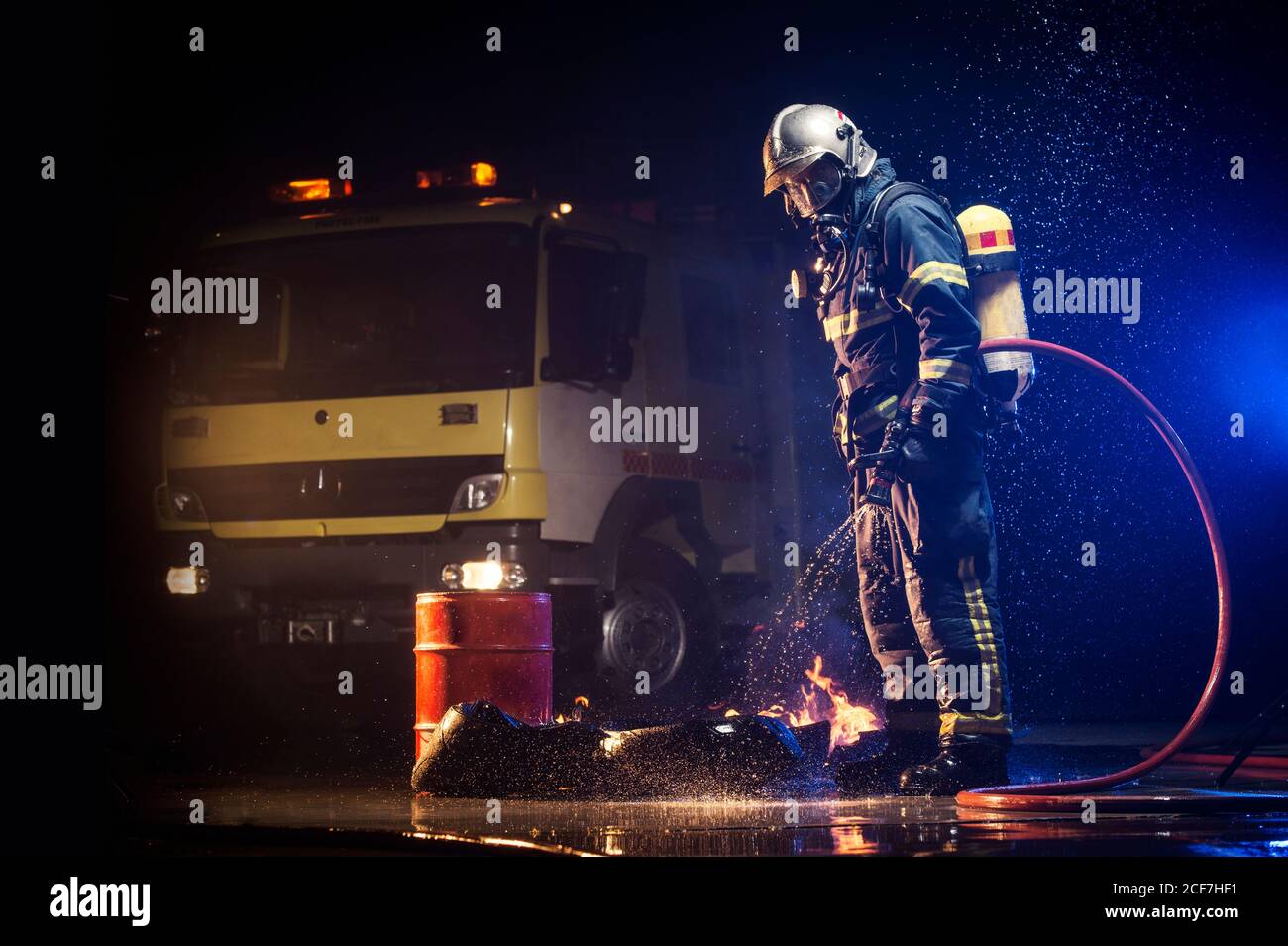 Firefighter using fire extinguisher hi-res stock photography and images ...
