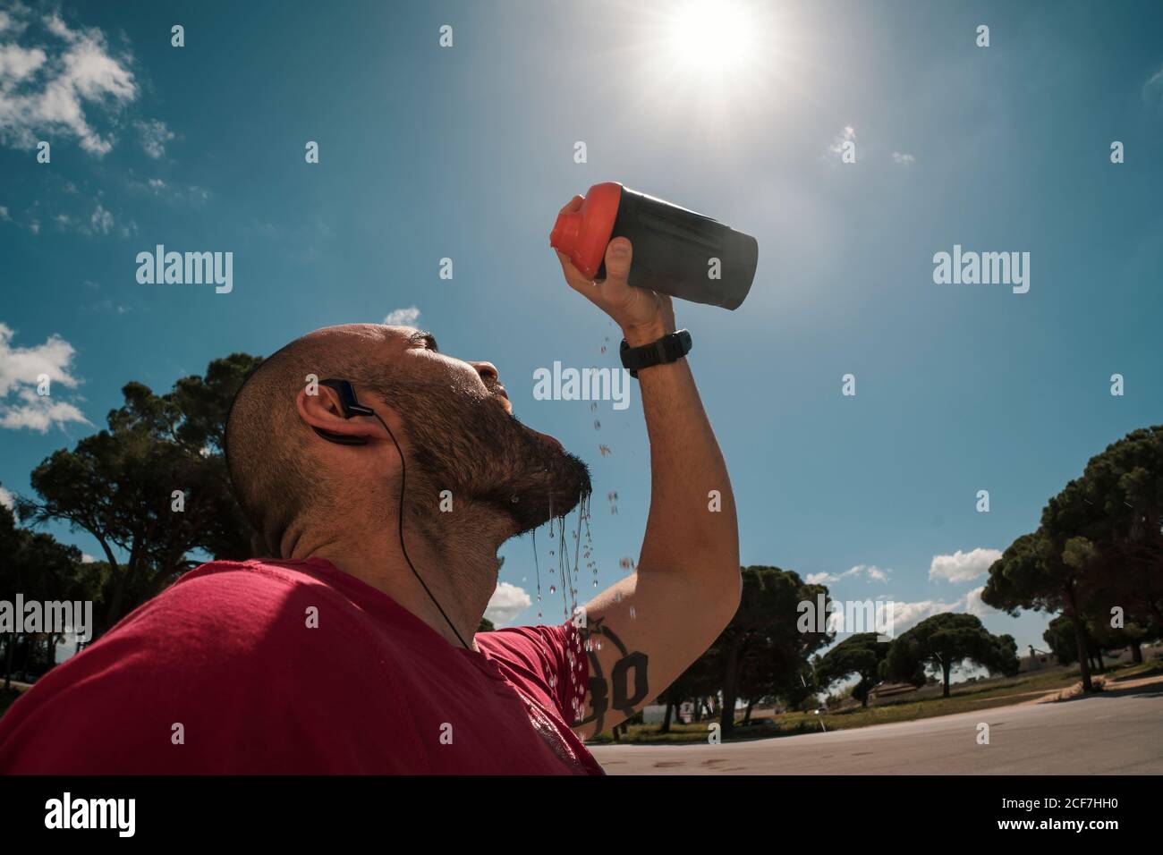 man drinking during training Stock Photo - Alamy