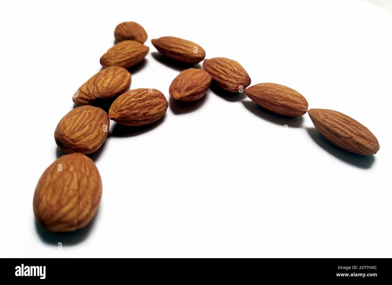 Letter 'A' made with almonds on a white background Stock Photo - Alamy