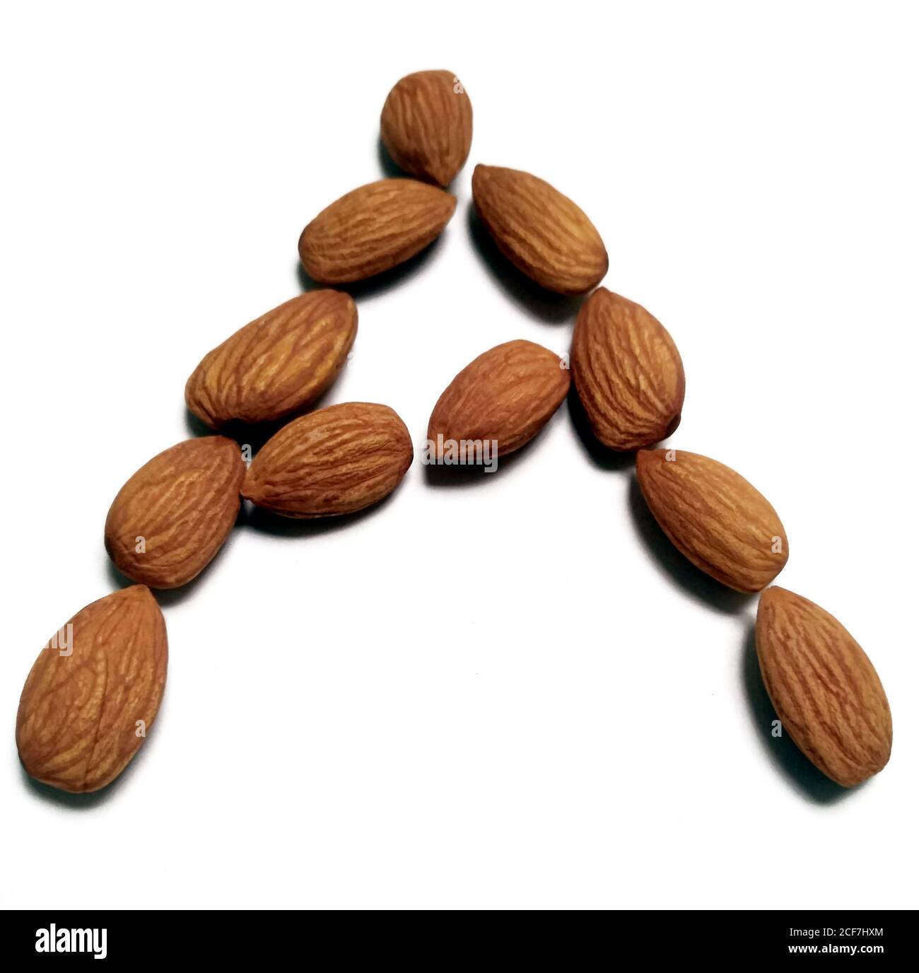 Letter 'A' made with almonds on a white background Stock Photo - Alamy