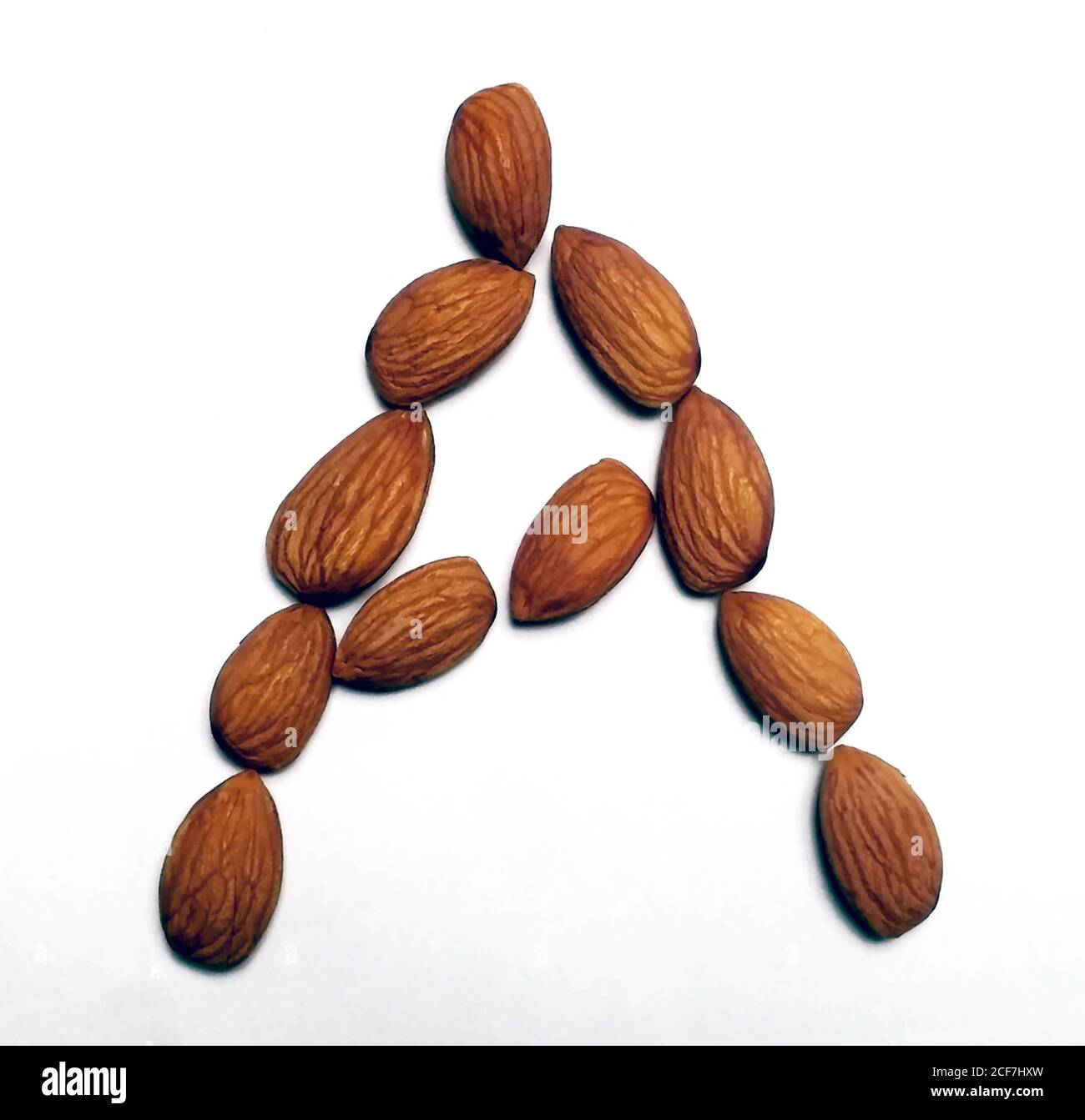 Letter 'A' made with almonds on a white background Stock Photo - Alamy