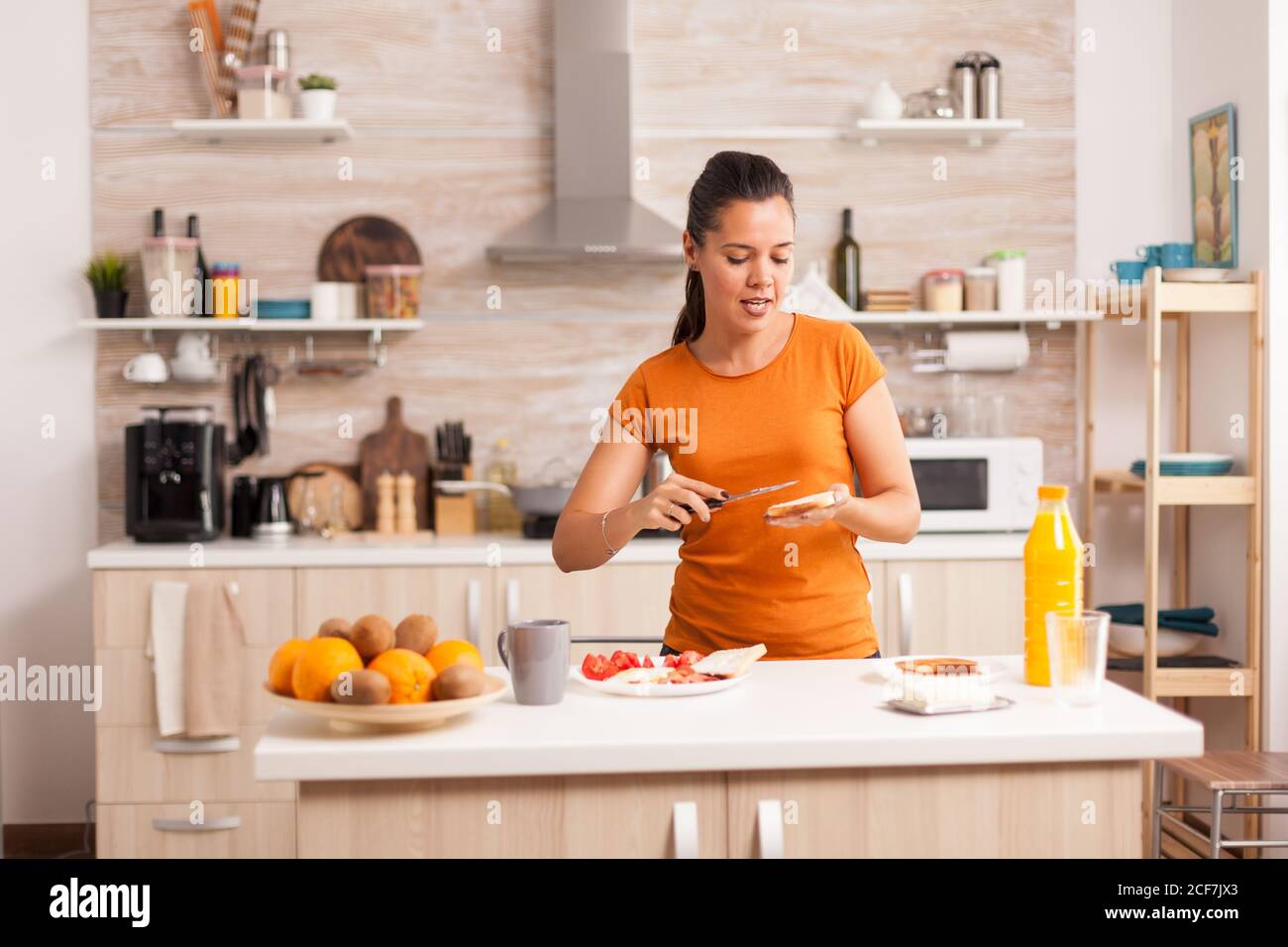 Woman smearing butter on hi-res stock photography and images - Alamy