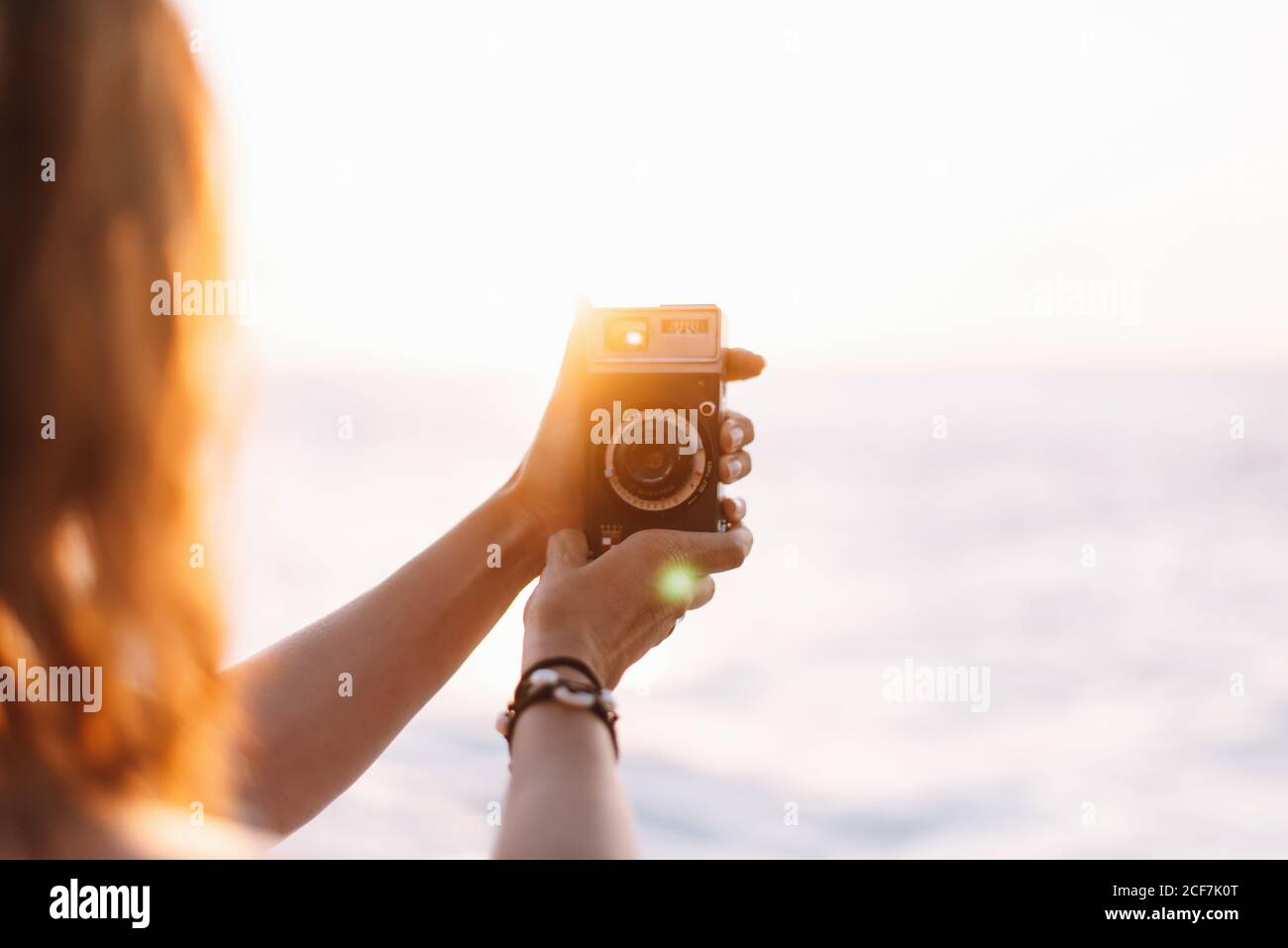 Woman capturing moment taking picture on camera Stock Photo - Alamy