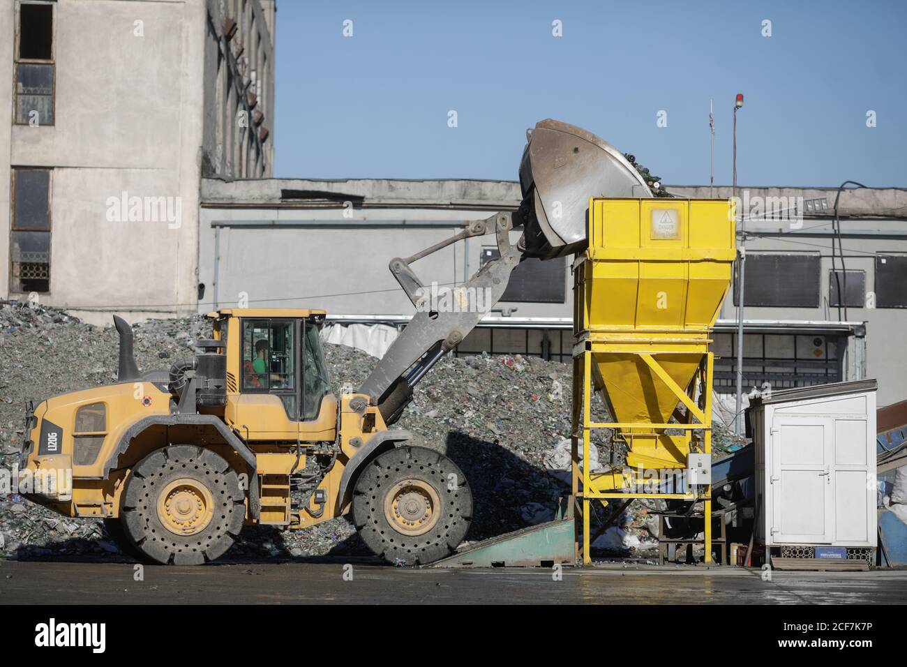 Bucharest, Romania - September 1, 2020: Earth mover operator arranging ...