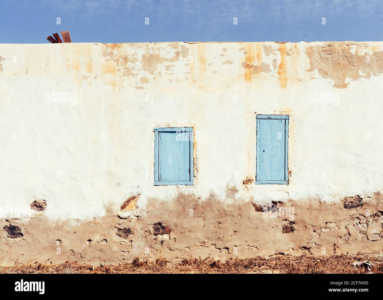 Closed window in rustic wall of old house Stock Photo - Alamy
