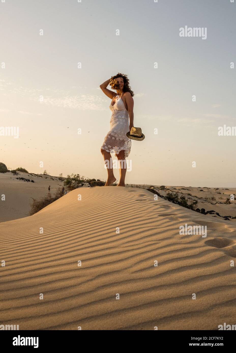 Active Woman walking in dry desert barefoot Stock Photo - Alamy