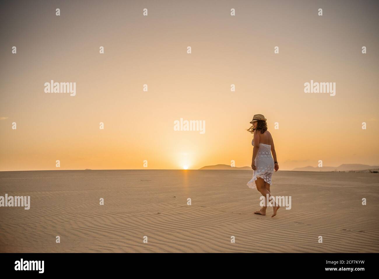 Active Woman walking in dry desert barefoot Stock Photo - Alamy