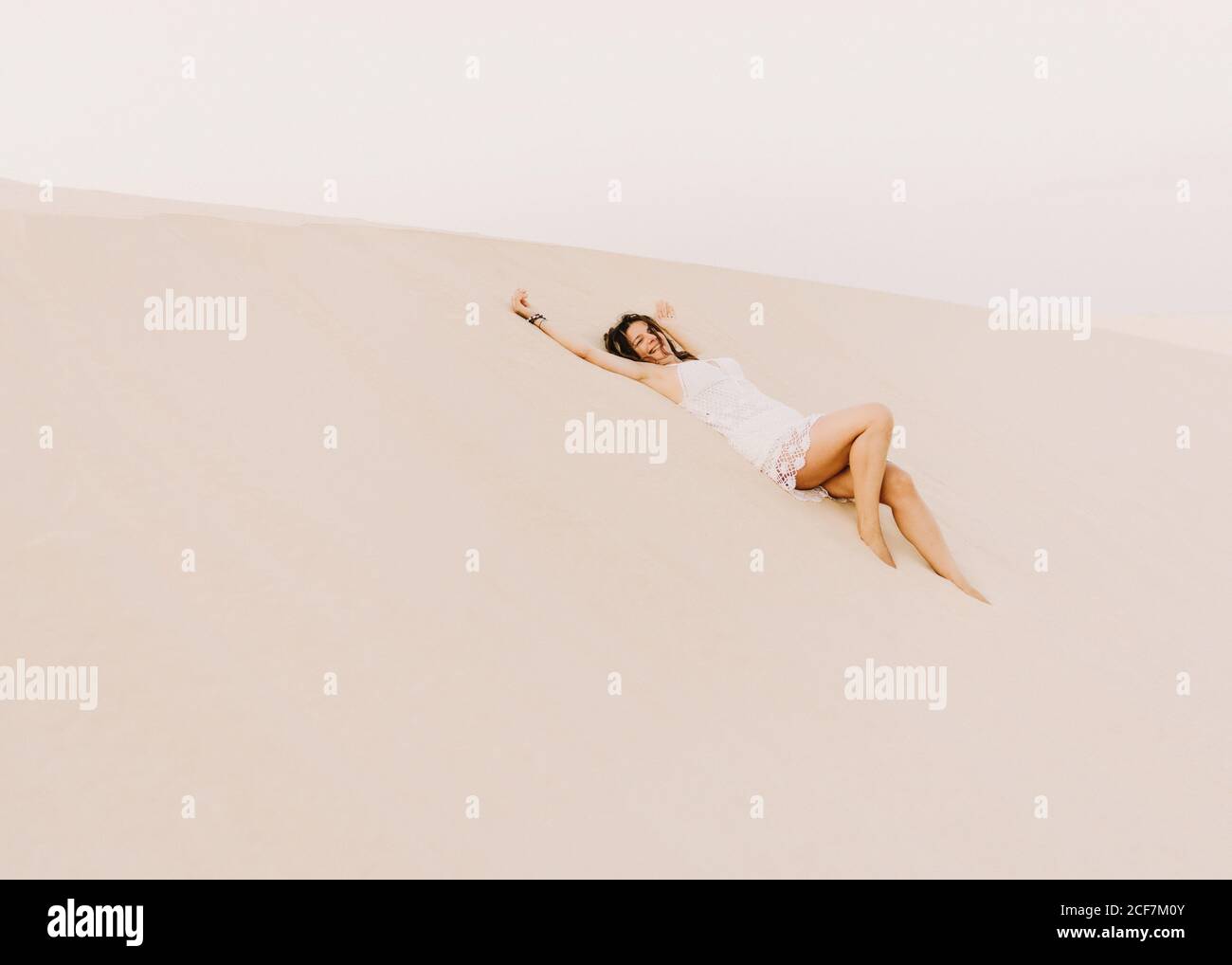 Woman lying on dune hi-res stock photography and images - Alamy