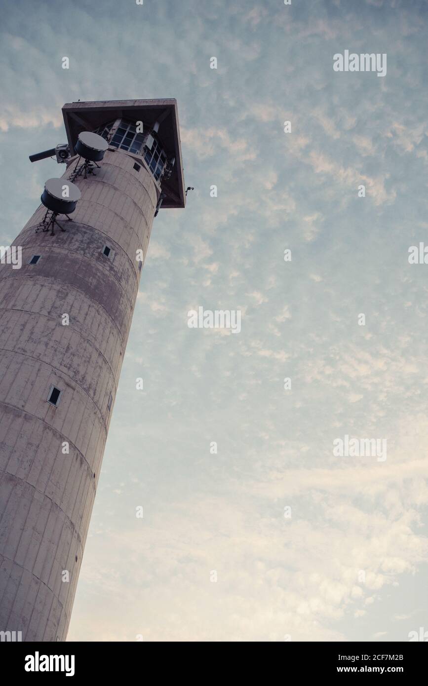 Round grey lighthouse tower rising up to sky Stock Photo - Alamy