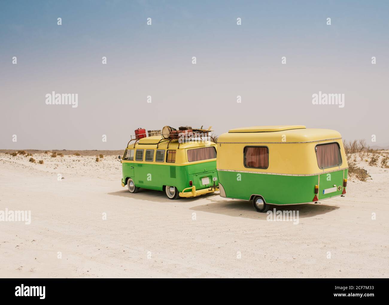 Colorful minibus with trailer parked on sandy shore in sunny day Stock ...