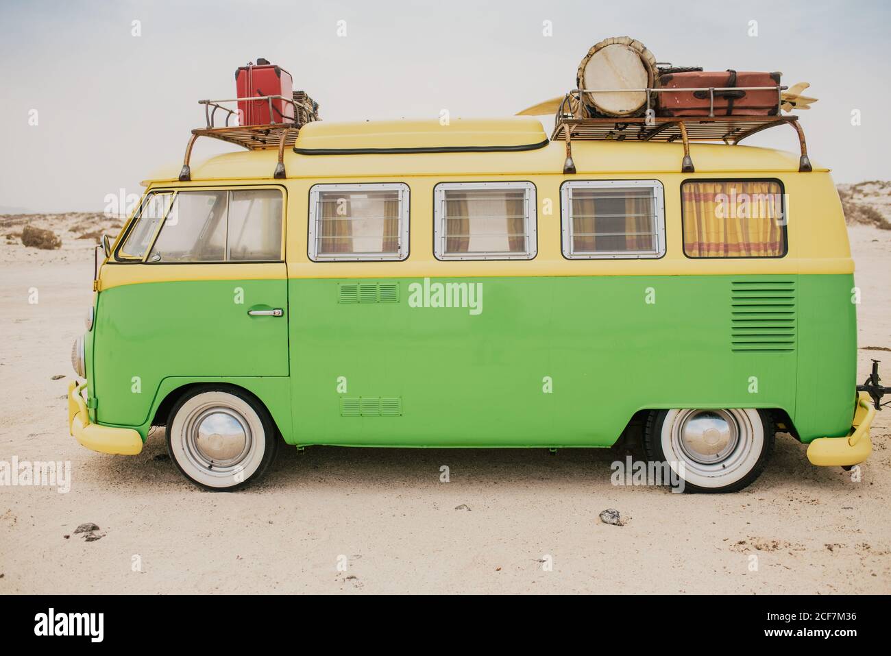 Colorful minibus with trailer parked on sandy shore in sunny day Stock ...