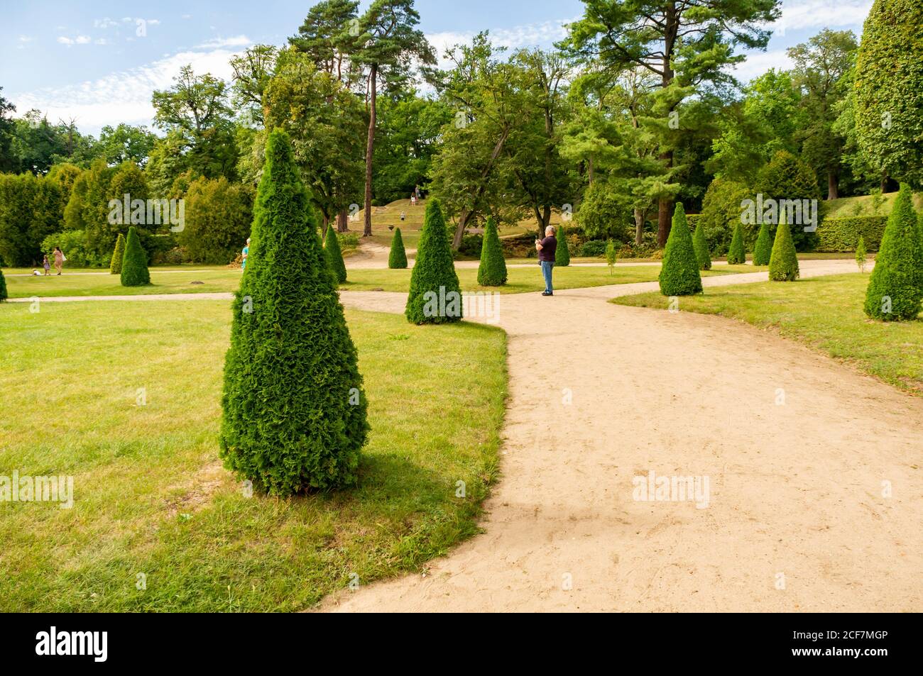 ROGALIN, POLAND - Aug 23, 2020: Footpath along green grass and planted ...