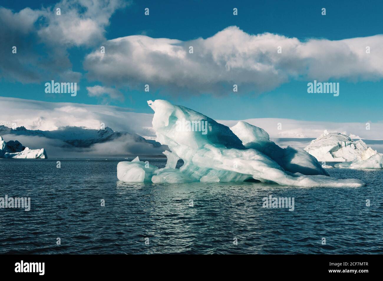 Picturesque view of ice on water surface in winter and blue heaven with ...