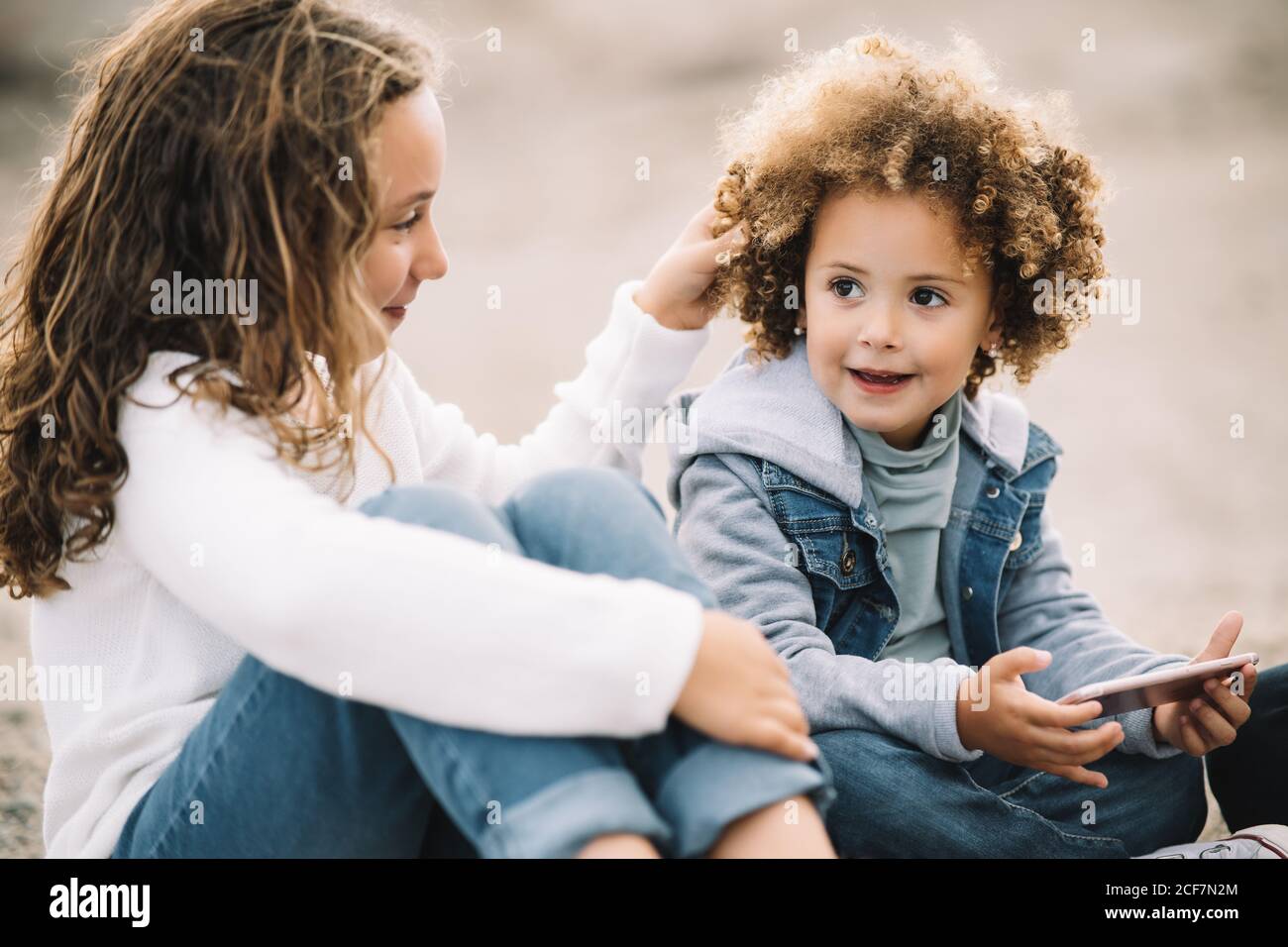 Clasping knees hi-res stock photography and images - Alamy