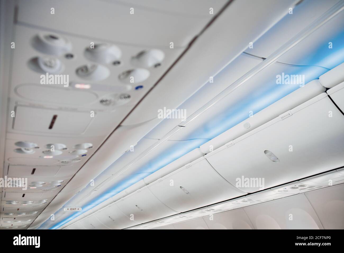 White aircraft ceiling compartment with different buttons Stock Photo ...